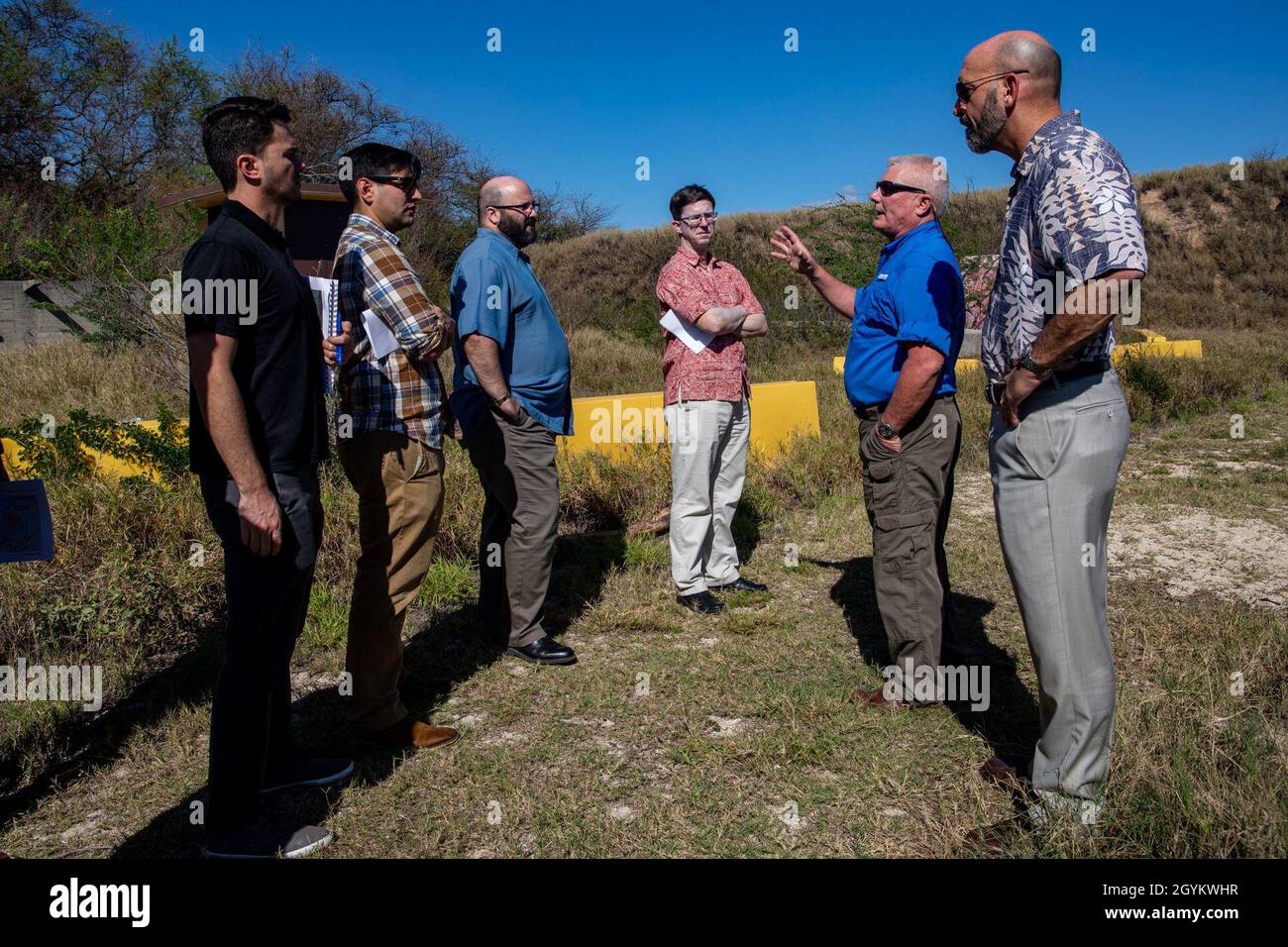 Congressional staffers stop to ask questions during a tour of Pu’uloa ...
