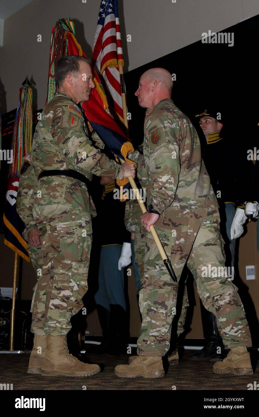 Command Sgt. Maj. Craig A. Bishop passes the 1st Infantry Division's ...