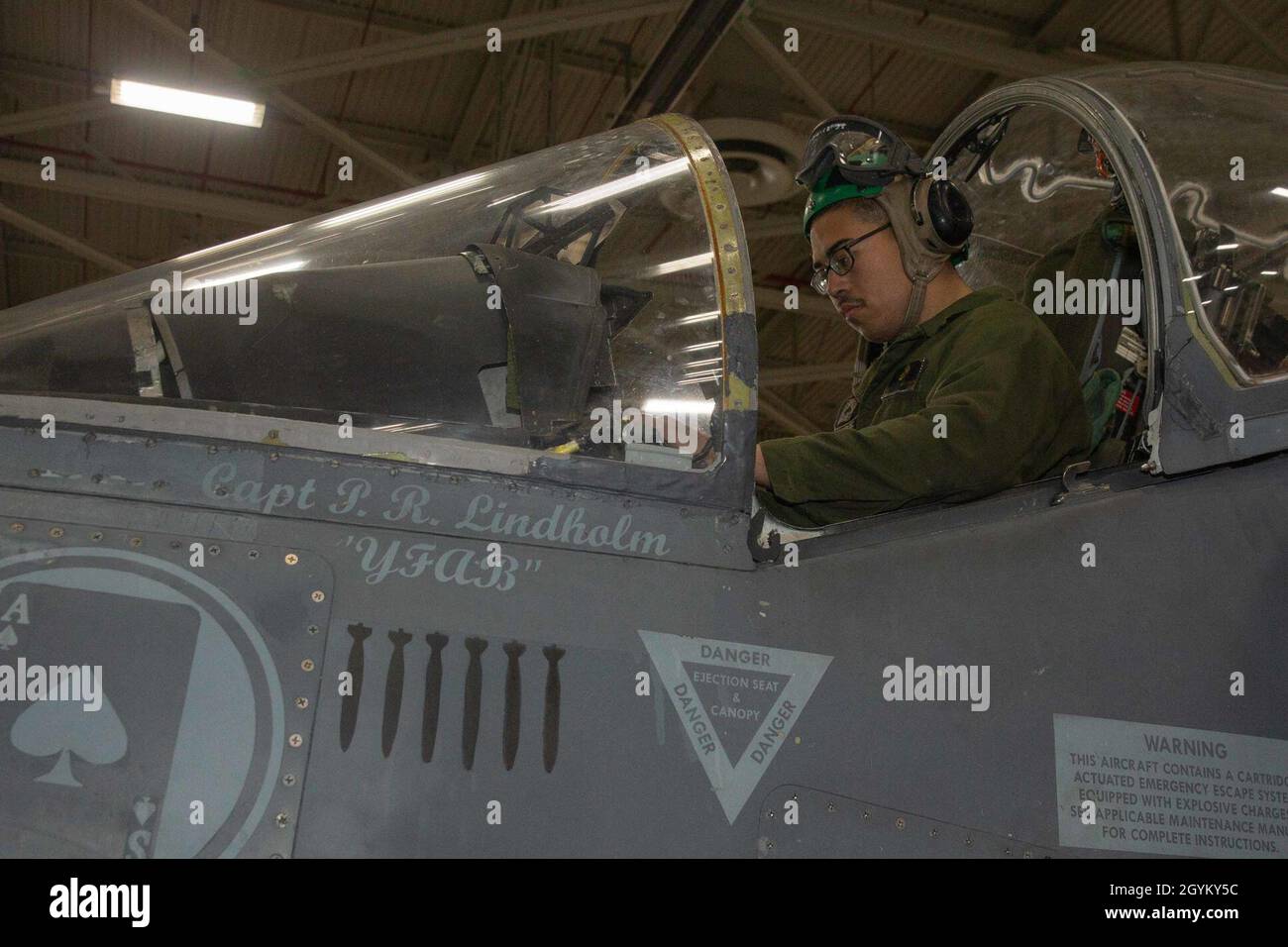 Marine Sgt. Emanuel Goldsmith performs function checks on an AV-8B ...