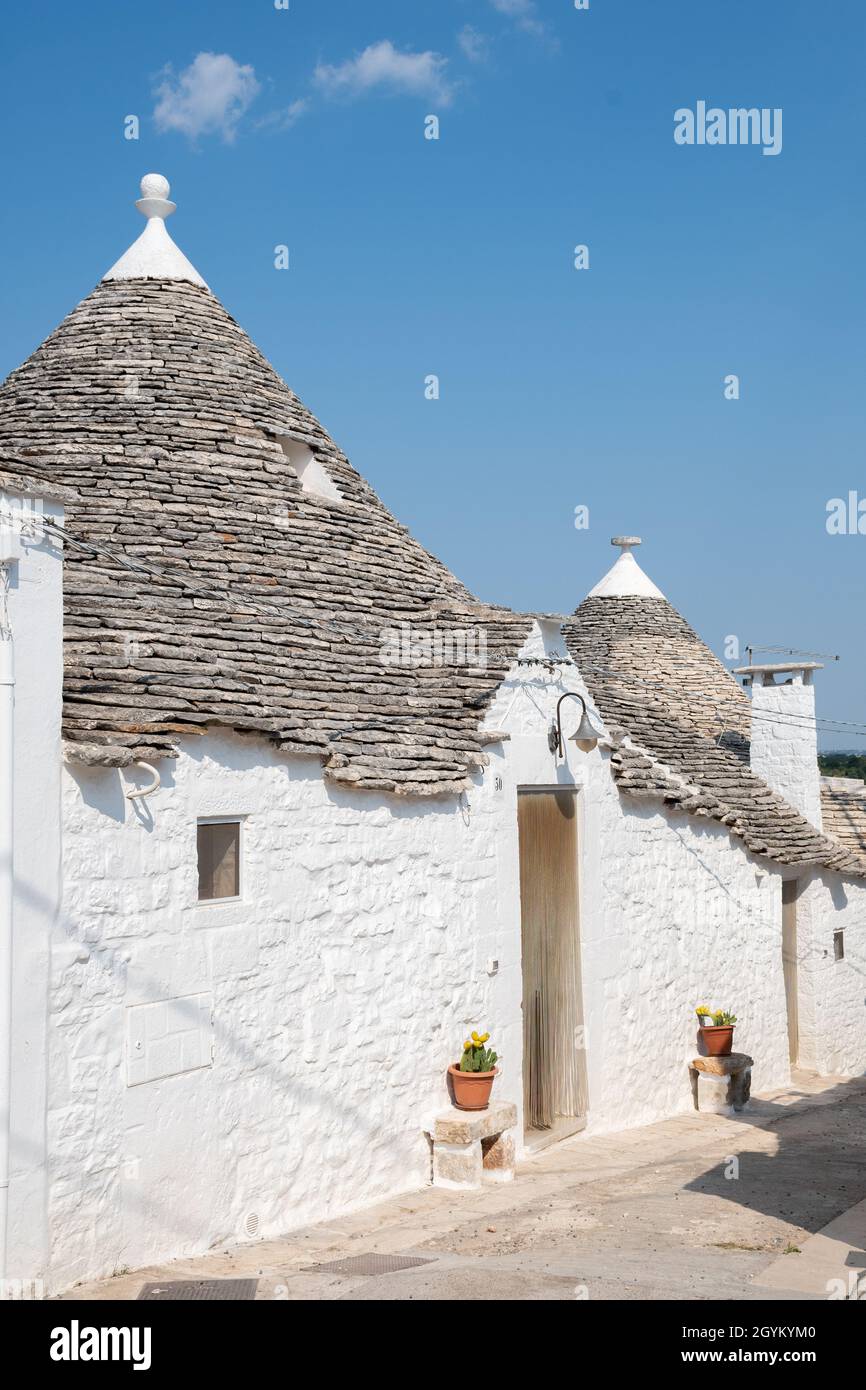 Group of beautiful Trulli, traditional Apulian dry stone wall hut old ...