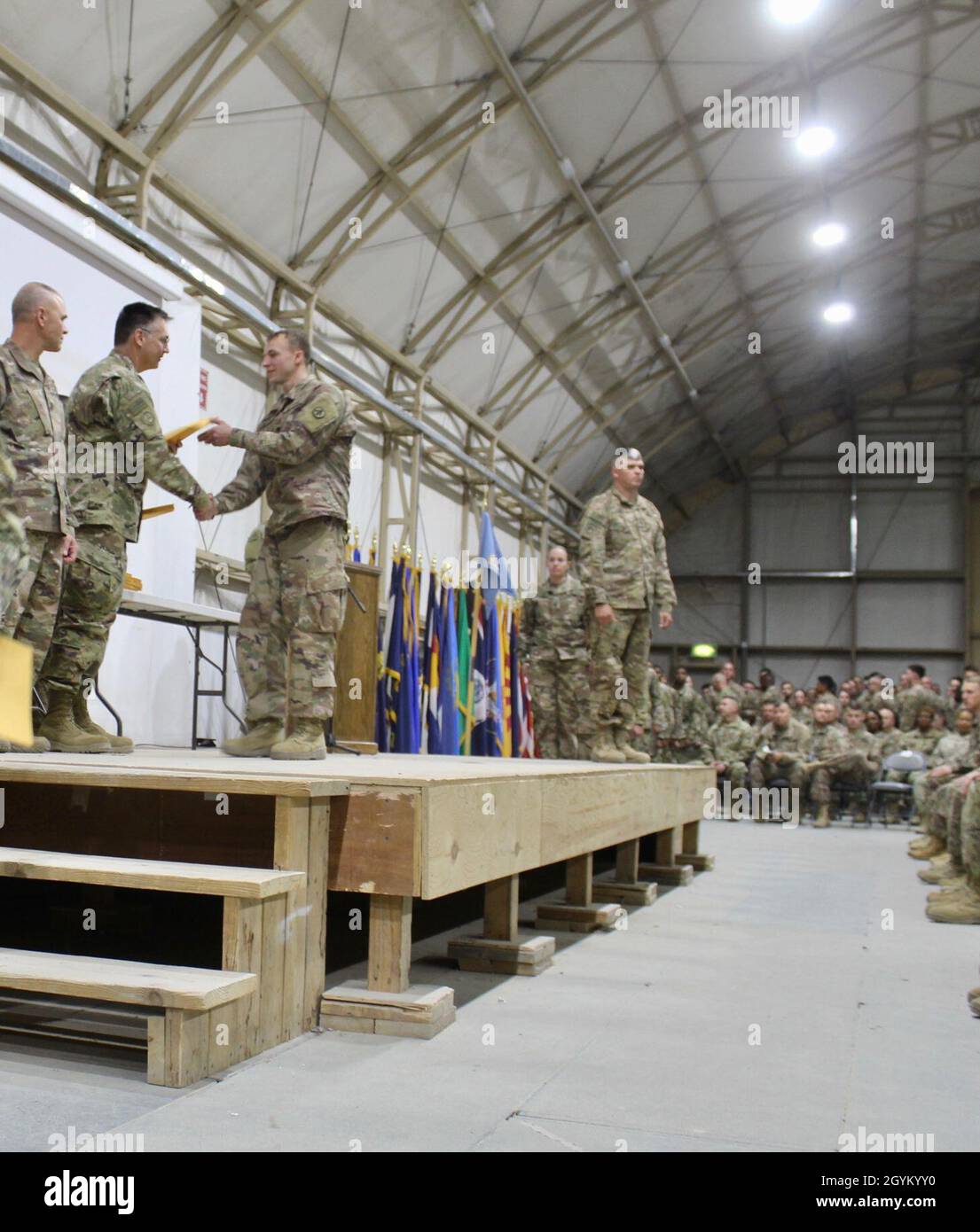Spc. Justin D. Hunter, 1188th Transportation Battalion, receives his ...