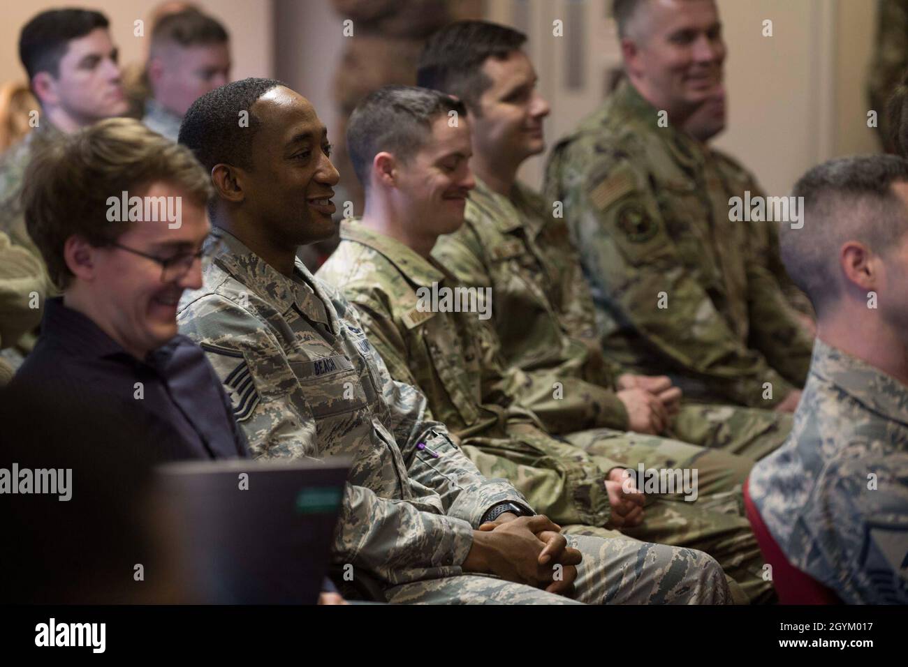 U.S. Air Force Airmen and civilian personnel engage with Col. Kurt ...