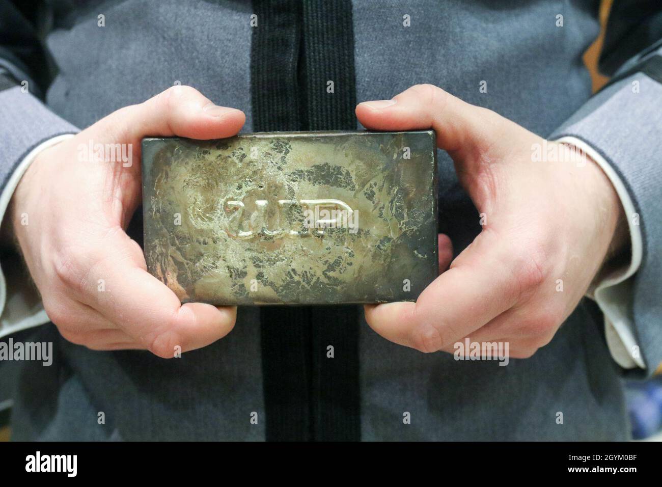 A member of the U.S. Military Academy Class of 2021 holds the finished ...