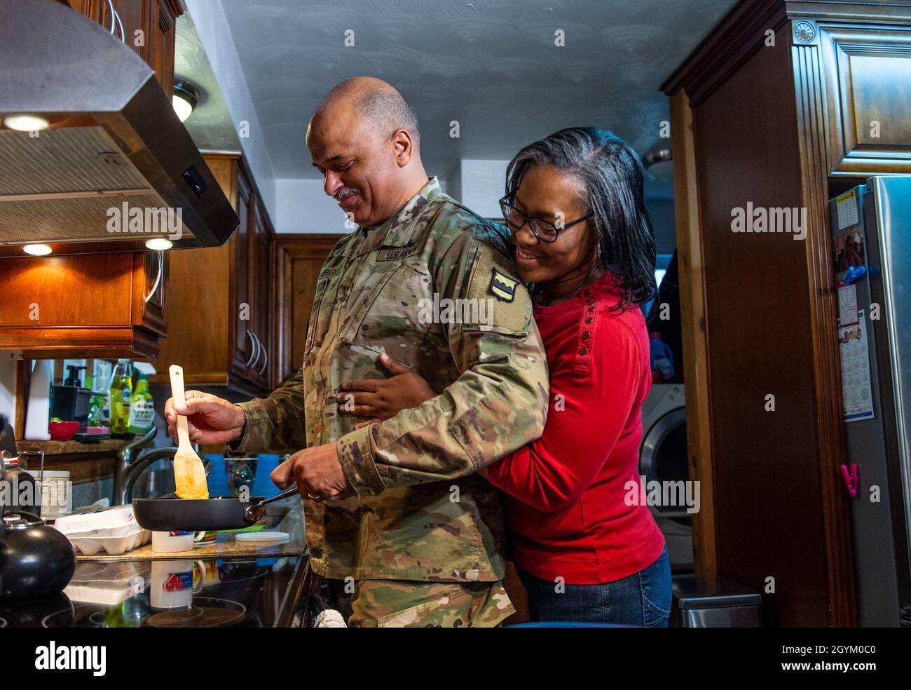 Sandra Brashear hugs her husband, Chief Warrant Officer 4 Phillip Brashear, a U.S. Army Reserve ...