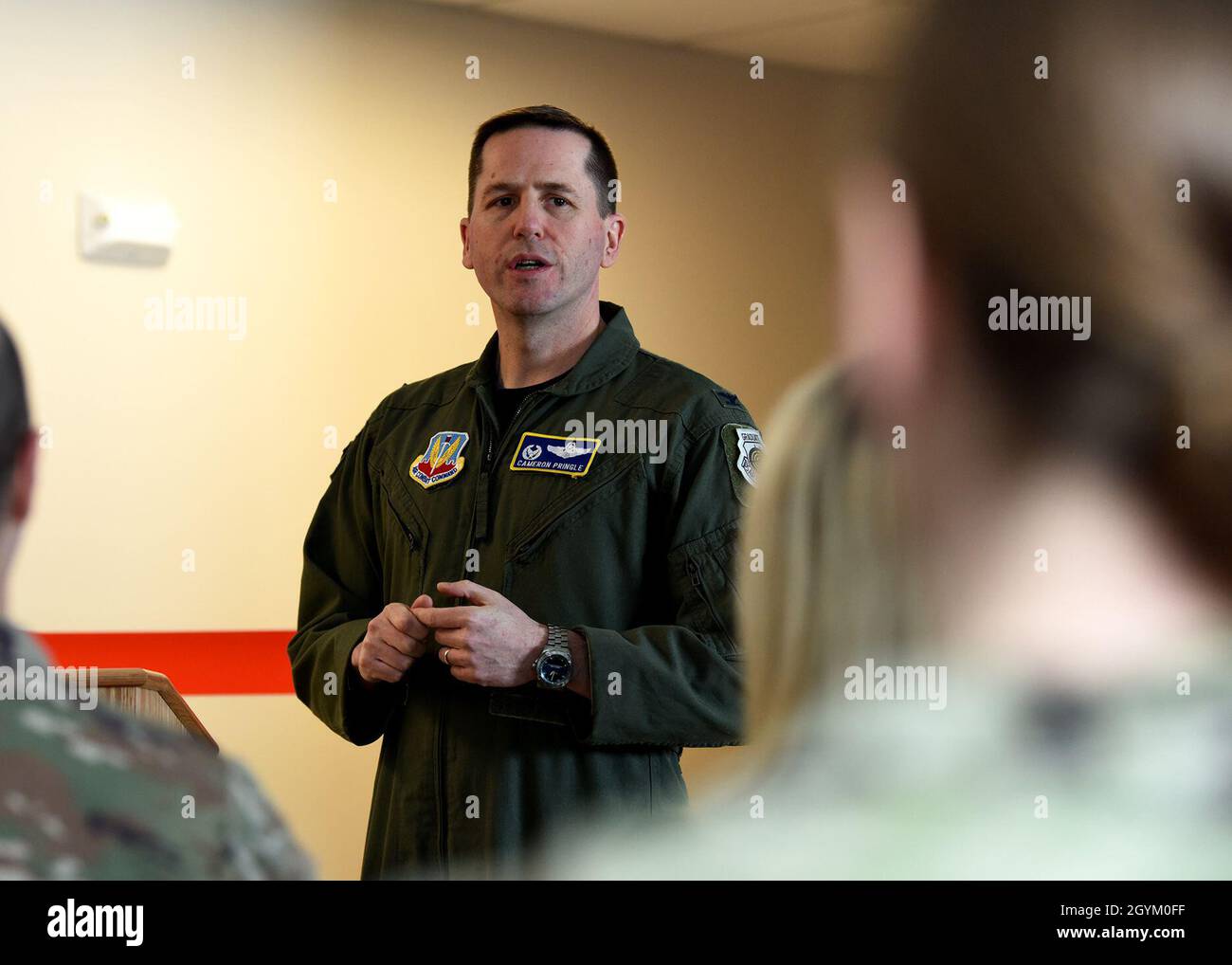 Col. Cameron Pringle, 319th Reconnaissance Wing commander, center, and ...