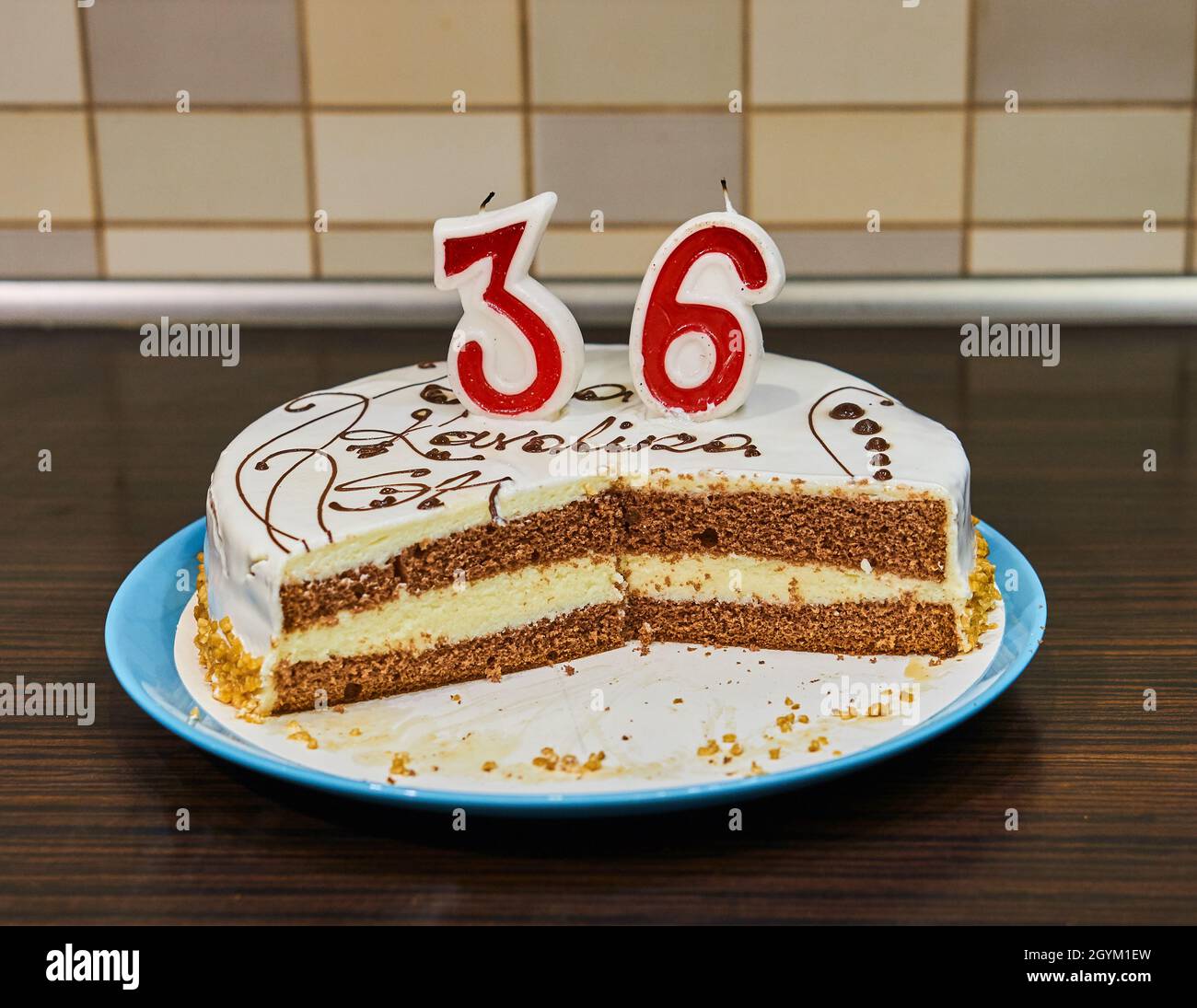 Birthday cake with burning candle number 36 Stock Photo - Alamy