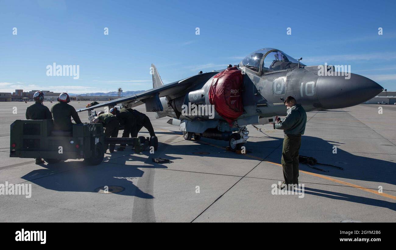 Marines with Marine attack Squadron 231 attach an AN/AAQ-28(V) LITENING ...