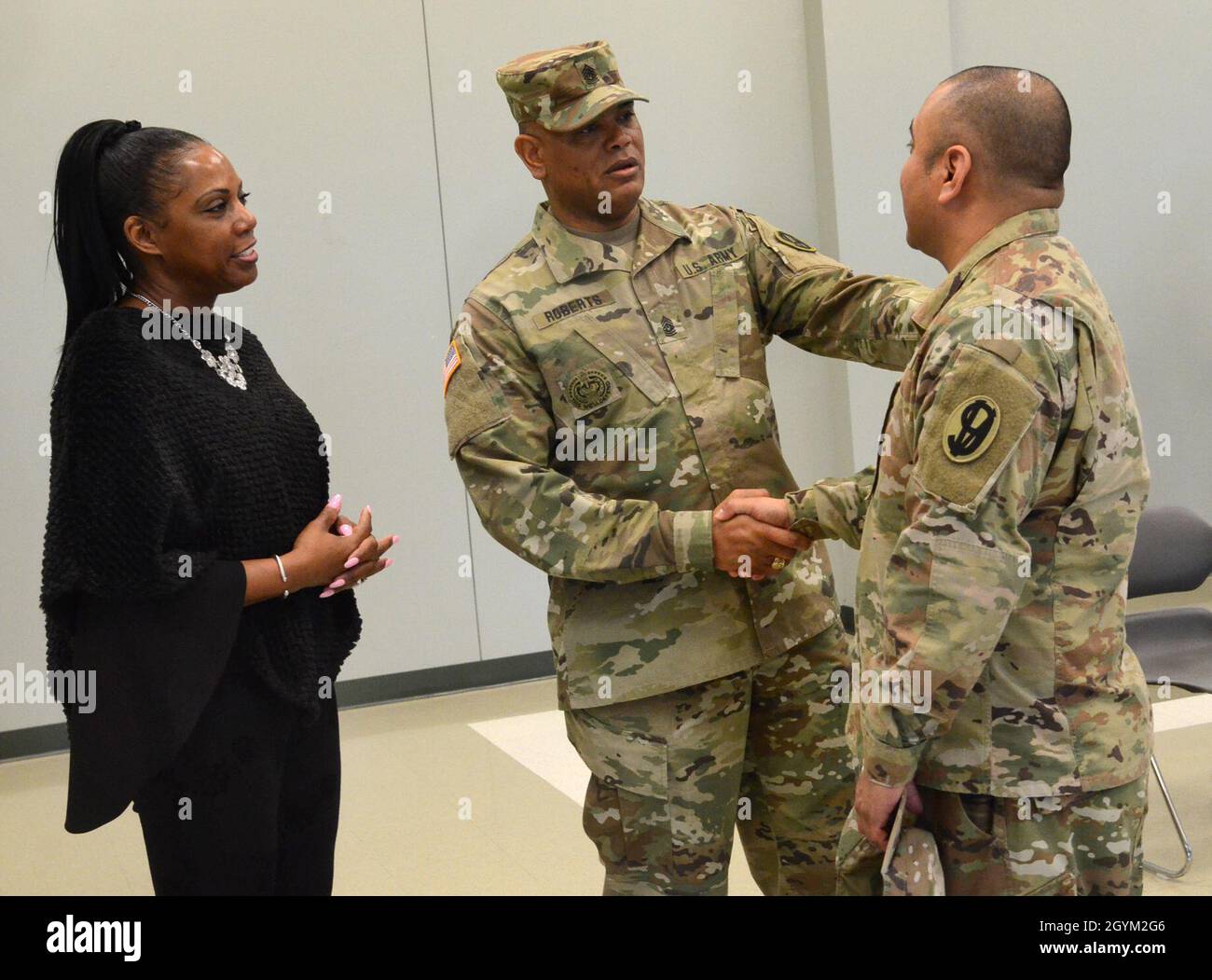 U.S. Army Reserve Command Sgt. Maj. Eric J. Roberts (center) along with ...