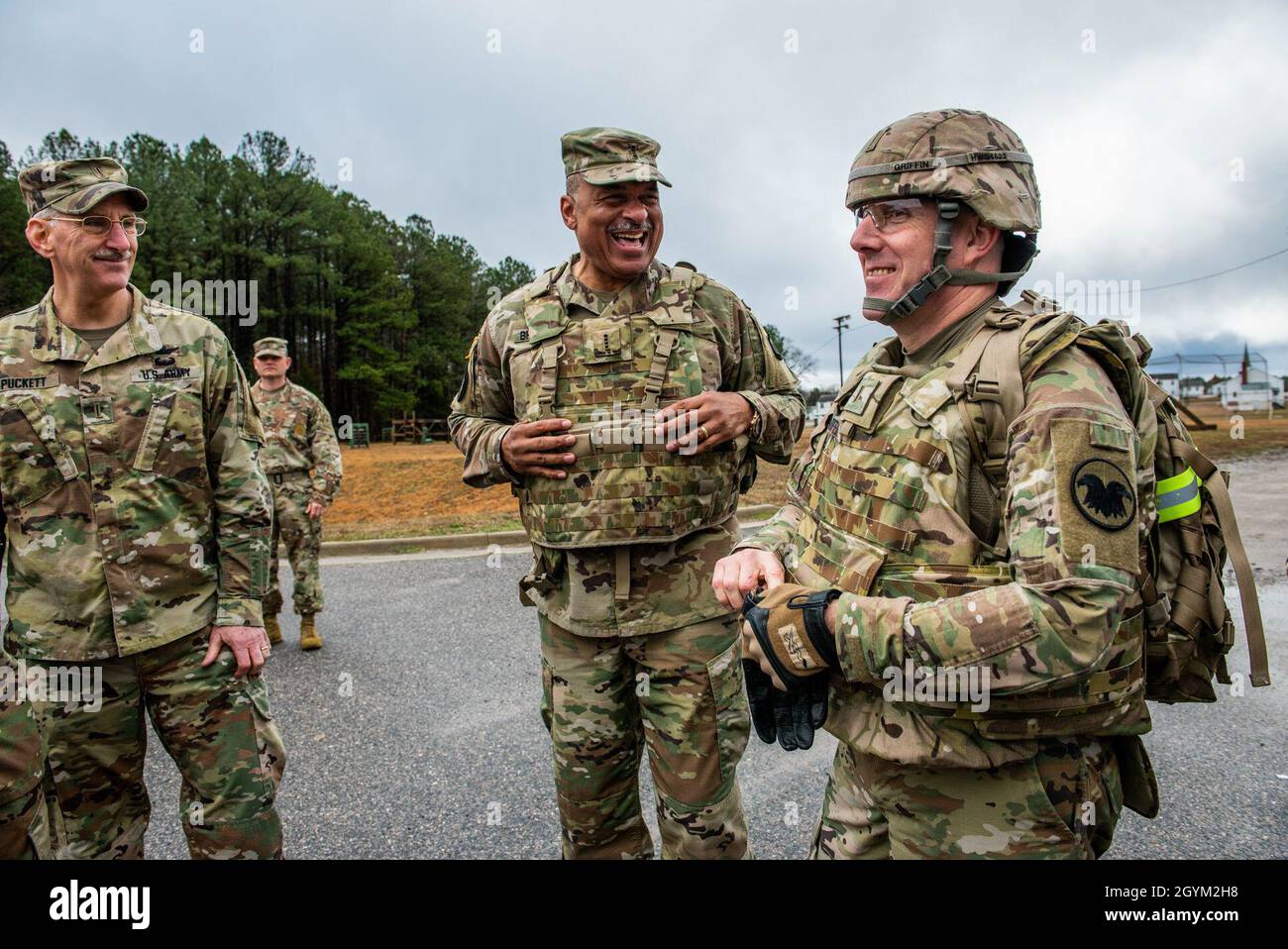 Chief Warrant Officer 4 Phillip Brashear (center), a U.S. Army Reserve command chief warrant ...