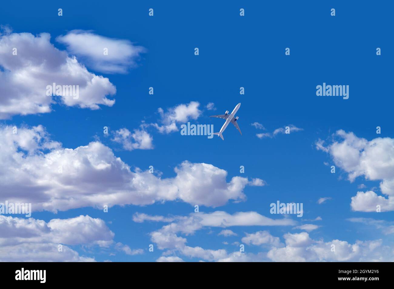 Sky with clouds with a airplane flying upward Stock Photo - Alamy