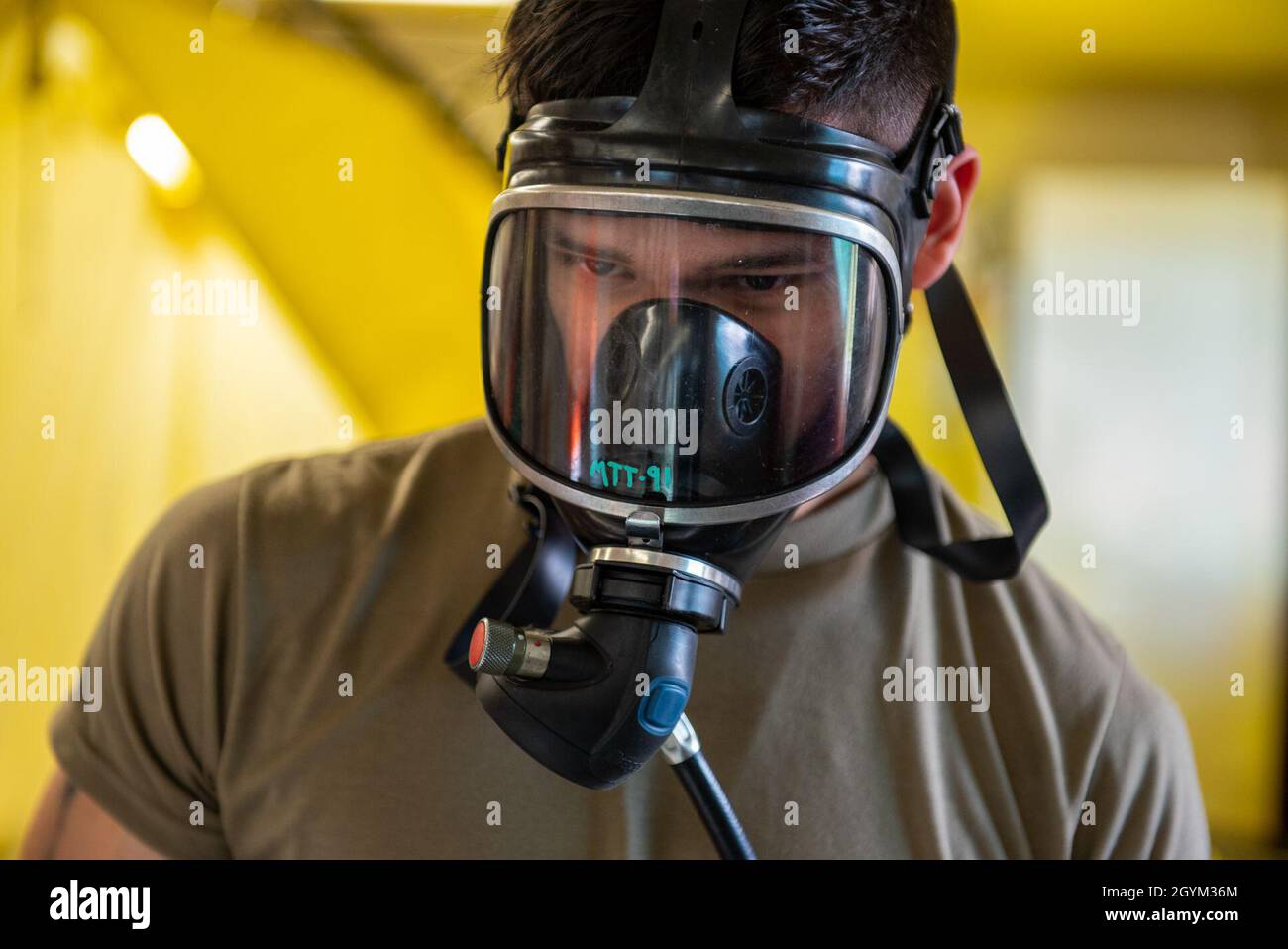 US Army Pfc. Benjamin Ruehs with the 102nd CERFP finishes removing his ...