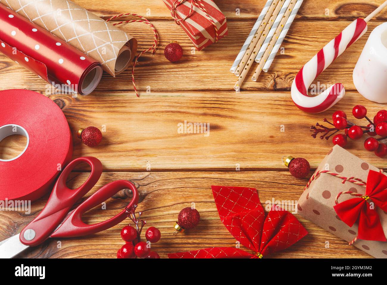 Christmas wrapping and decorating items on wooden background with copy ...
