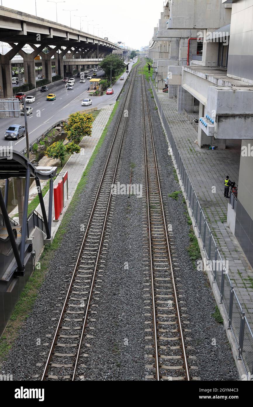double-track railroad railway or train tracks in suburb train station ...