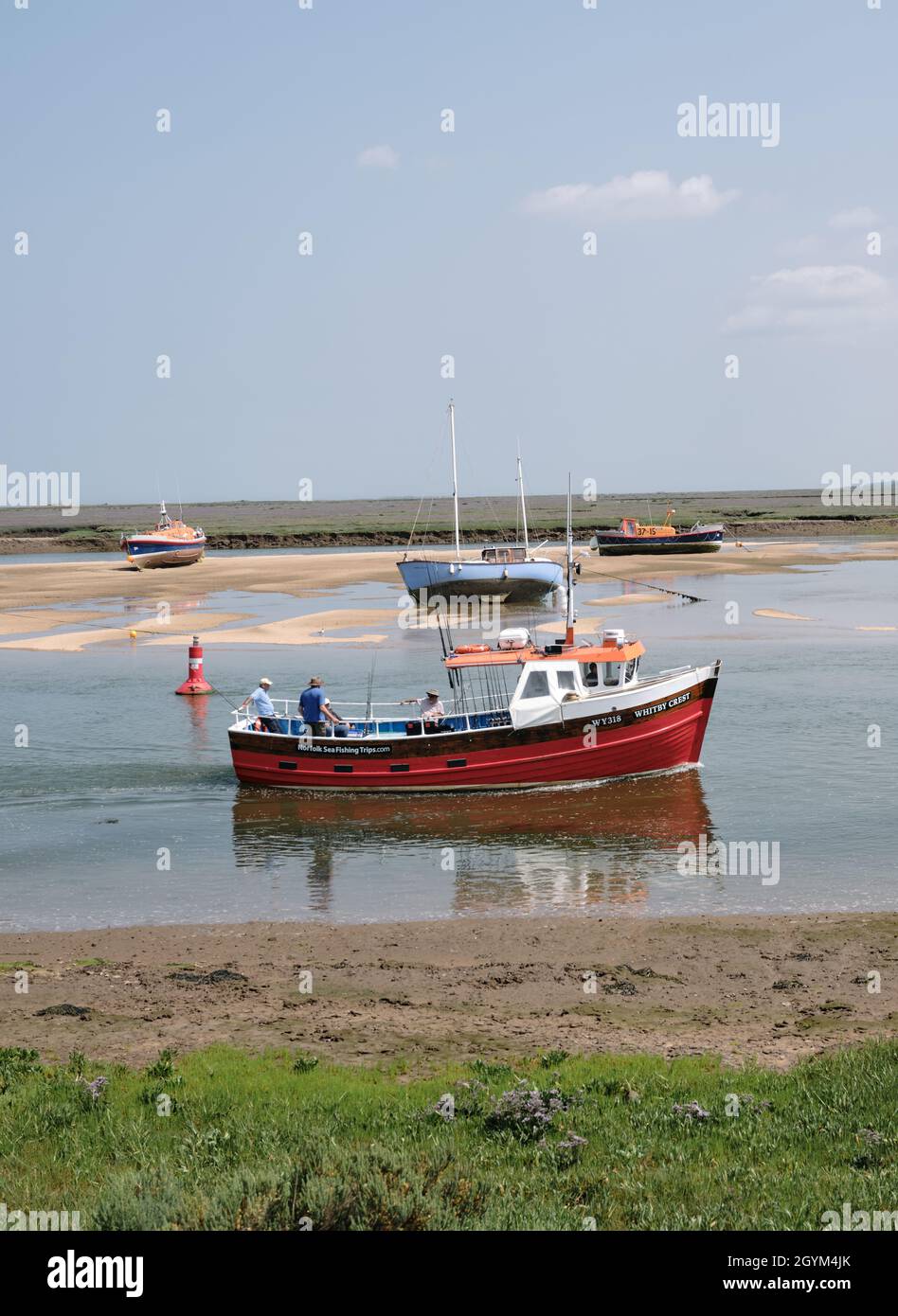Wells next to the sea fishing boat High Resolution Stock Photography ...