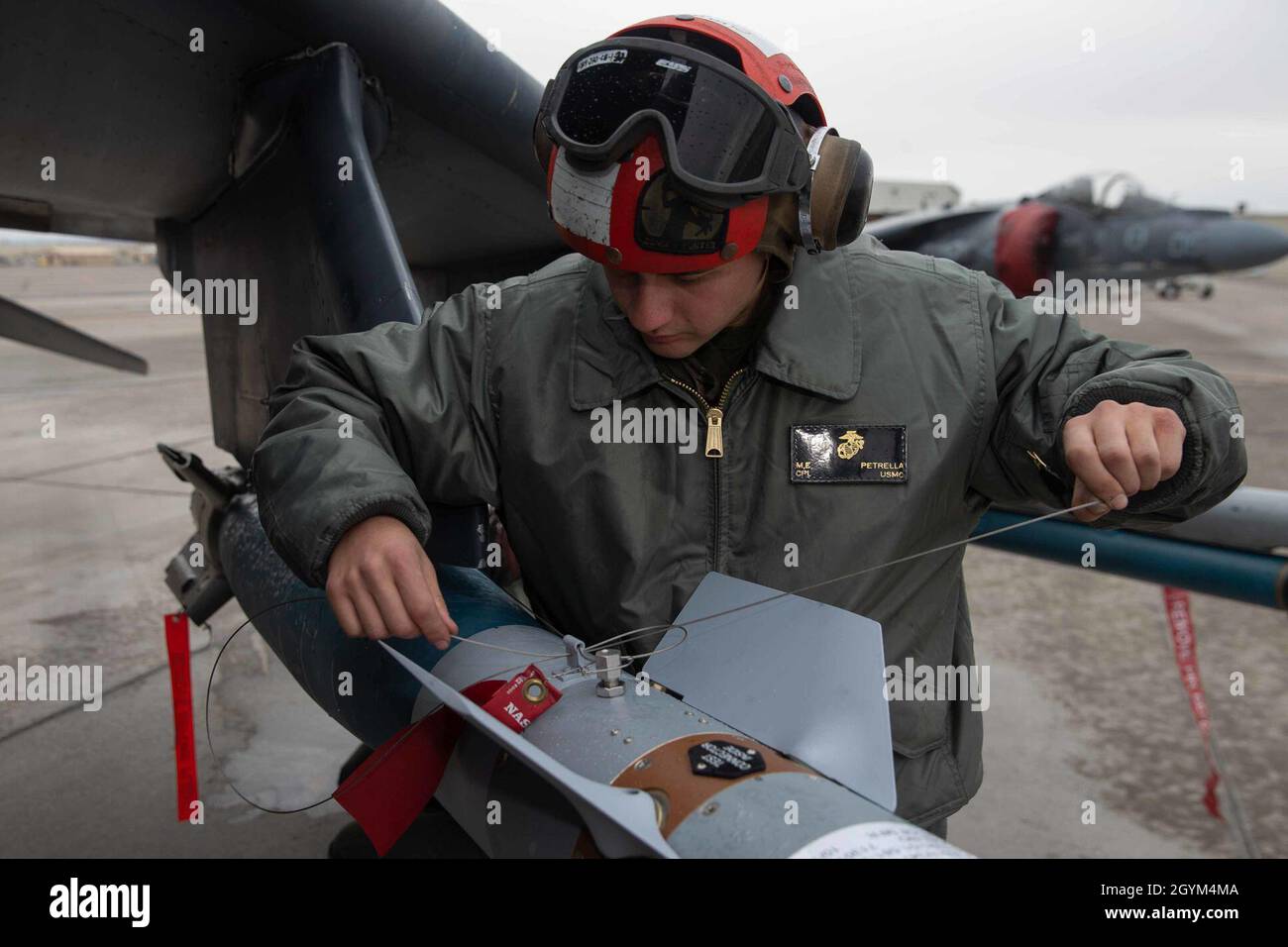 Marine Cpl. Michael Petrella attaches arming wire to a GBU-12 Paveway ...