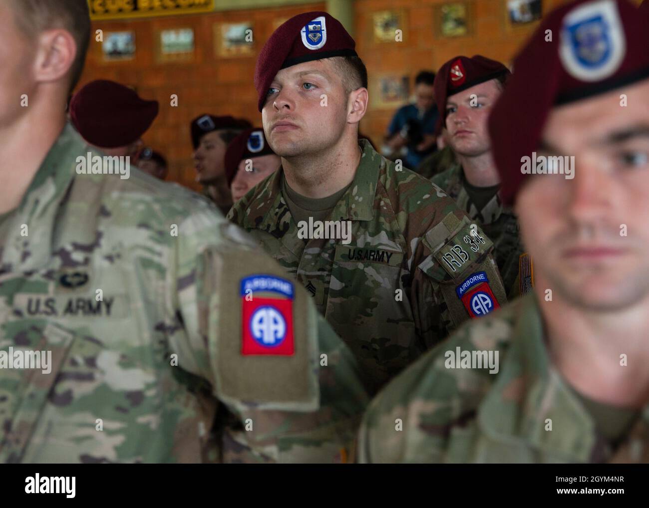 Paratroopers assigned to the 82nd Airborne Division stand in formation ...