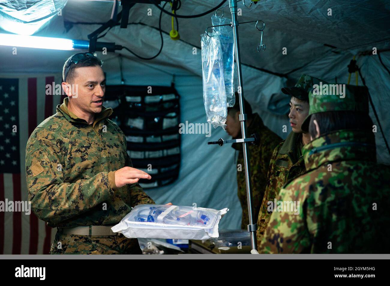 U.S. Navy Lt. Cmdr. Aaron Bernadette gives a period of instruction ...