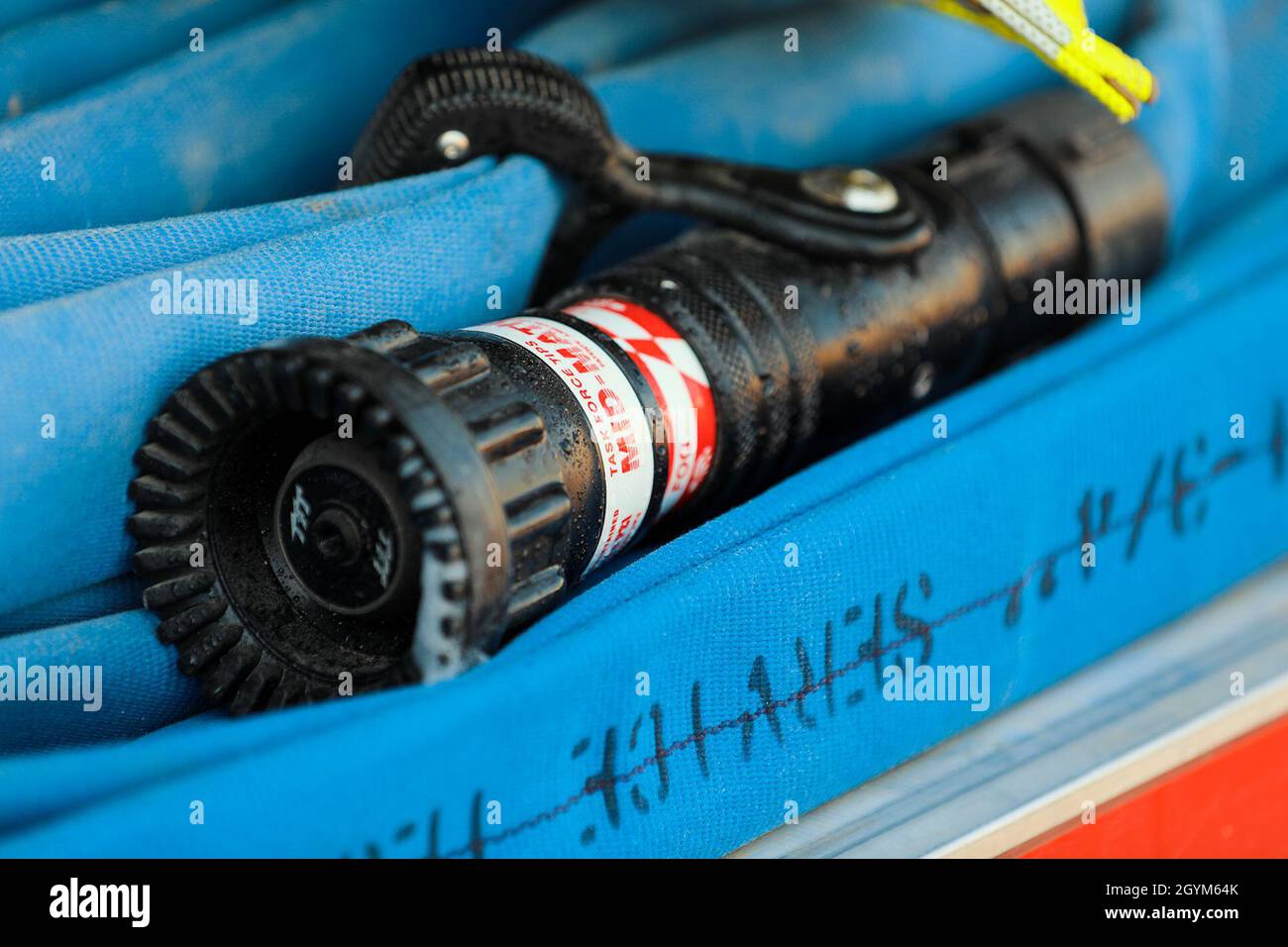 A hose is stored on the side of a fire truck at Al Asad Air Base, Iraq ...