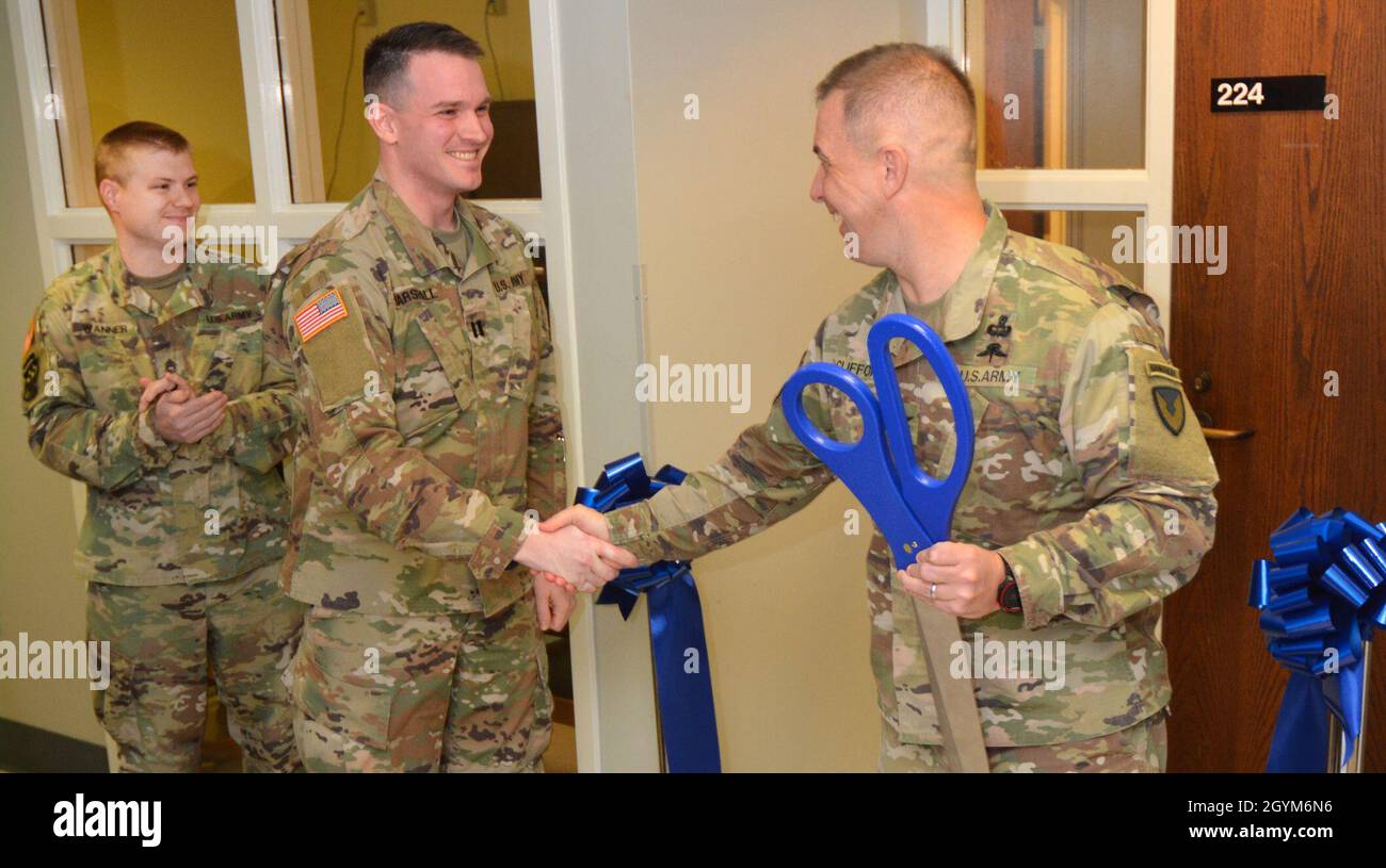 Col. Jim Clifford, right, Fort Gordon garrison commander, shares a ...