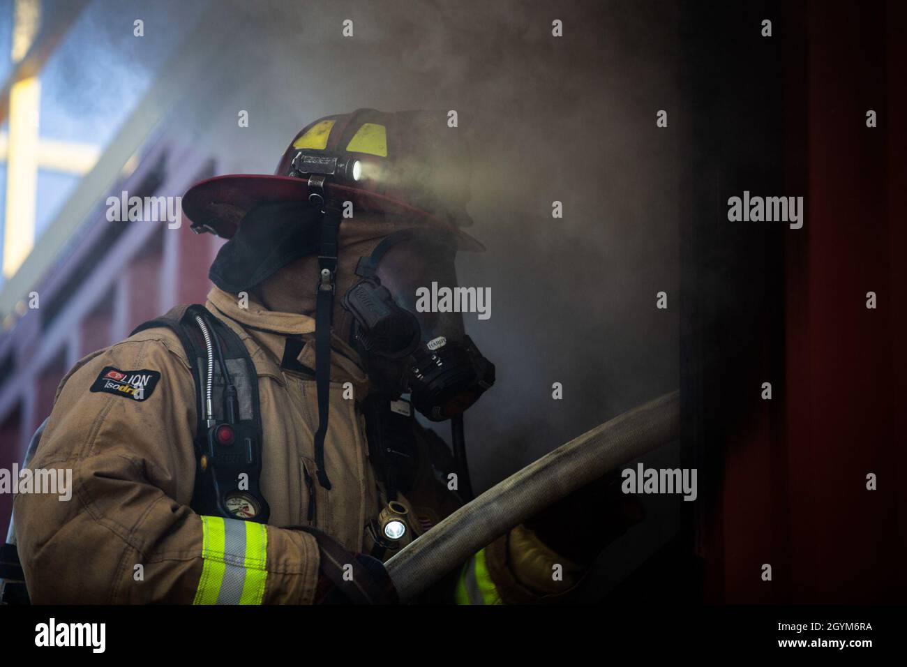 A firefighter with the Camp Pendleton Fire Department enters a burning ...