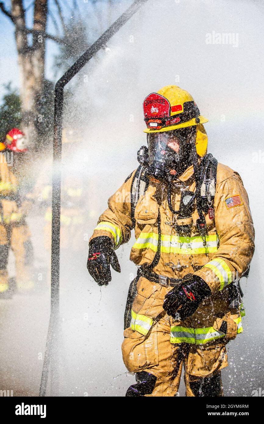 A firefighter with the Rincon Fire Department gets a decontamination ...