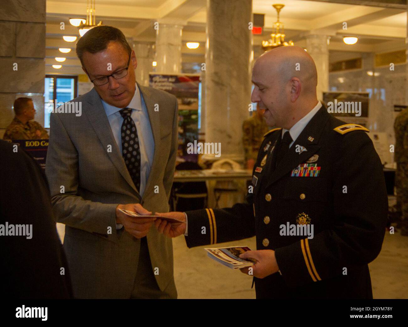 Col. Joel Grant, Chief of Staff, 807th MC(DS), speaks with Peter Jenks ...