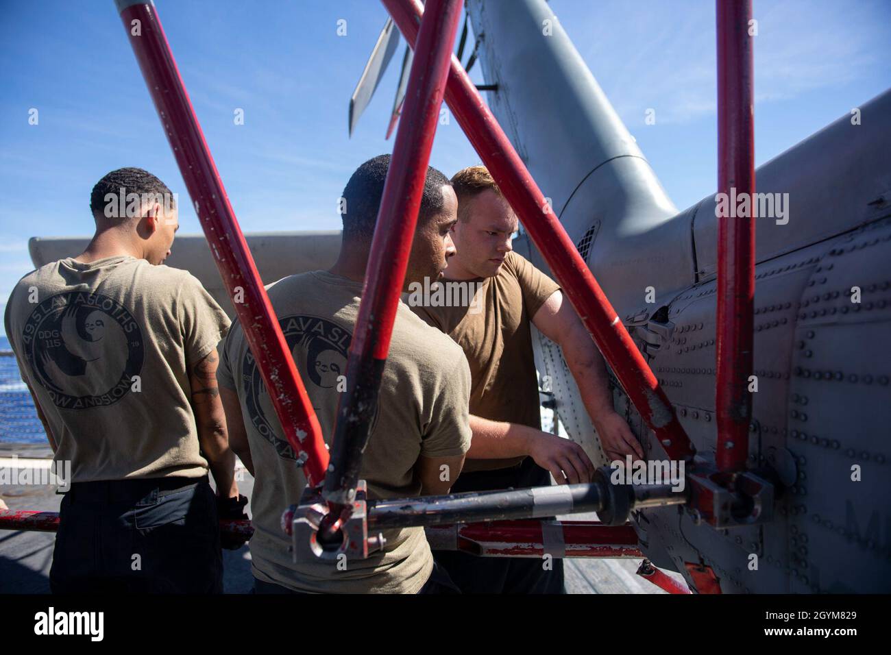 PACIFIC OCEAN (Jan. 28, 2020) Sailors secure the tail of an MH-60R Sea ...