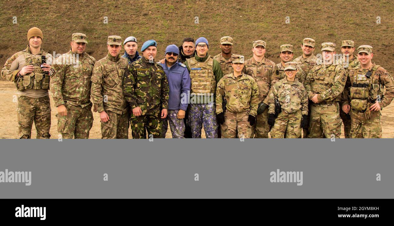 Romanian Armed Service members and soldiers with the 382nd Military ...