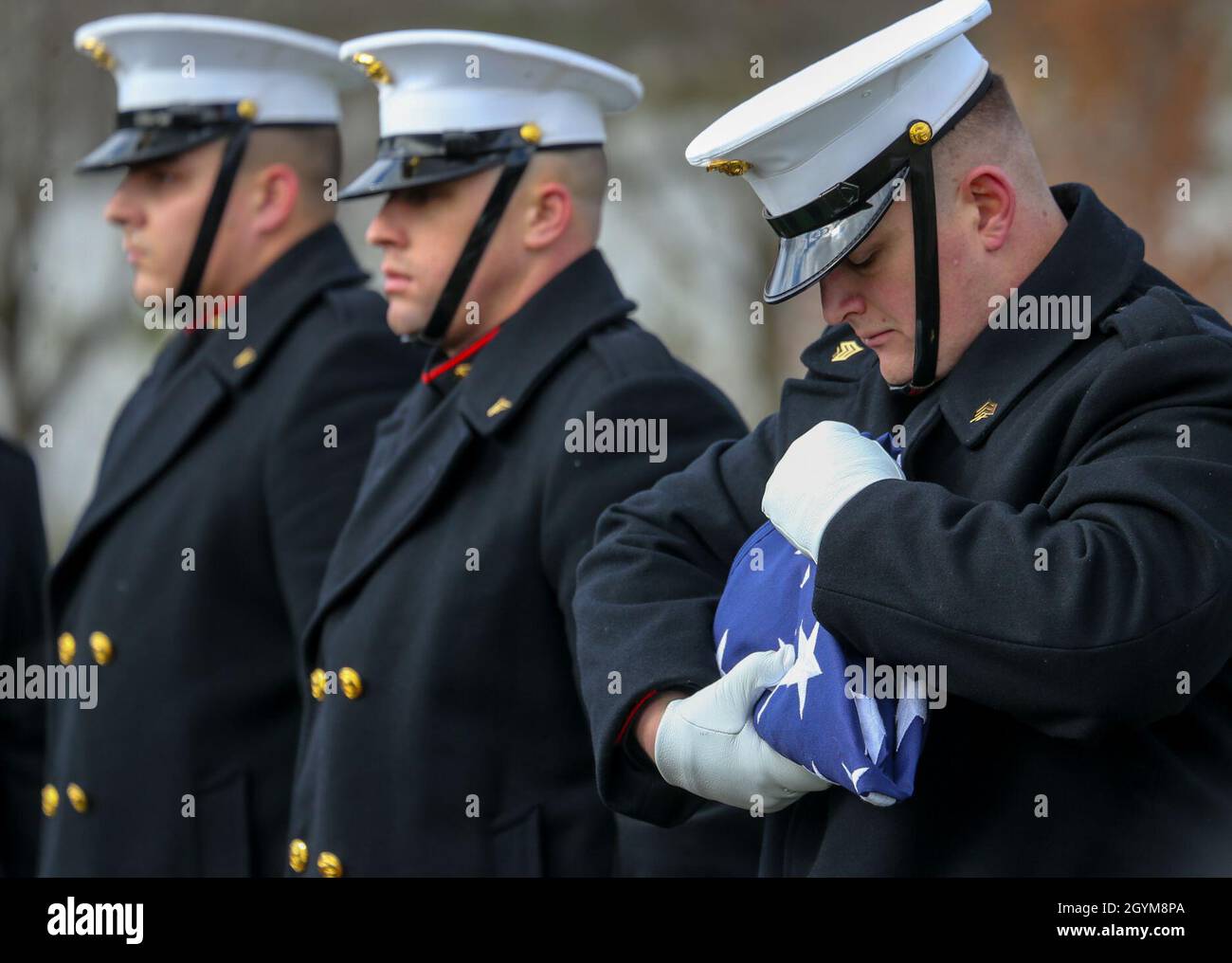 Body Bearers with Bravo Company, Marine Barracks Washington, fold the ...