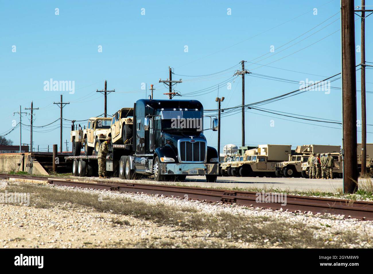1st Cavalry Division Sustainment Brigade begins to load vehicles during ...