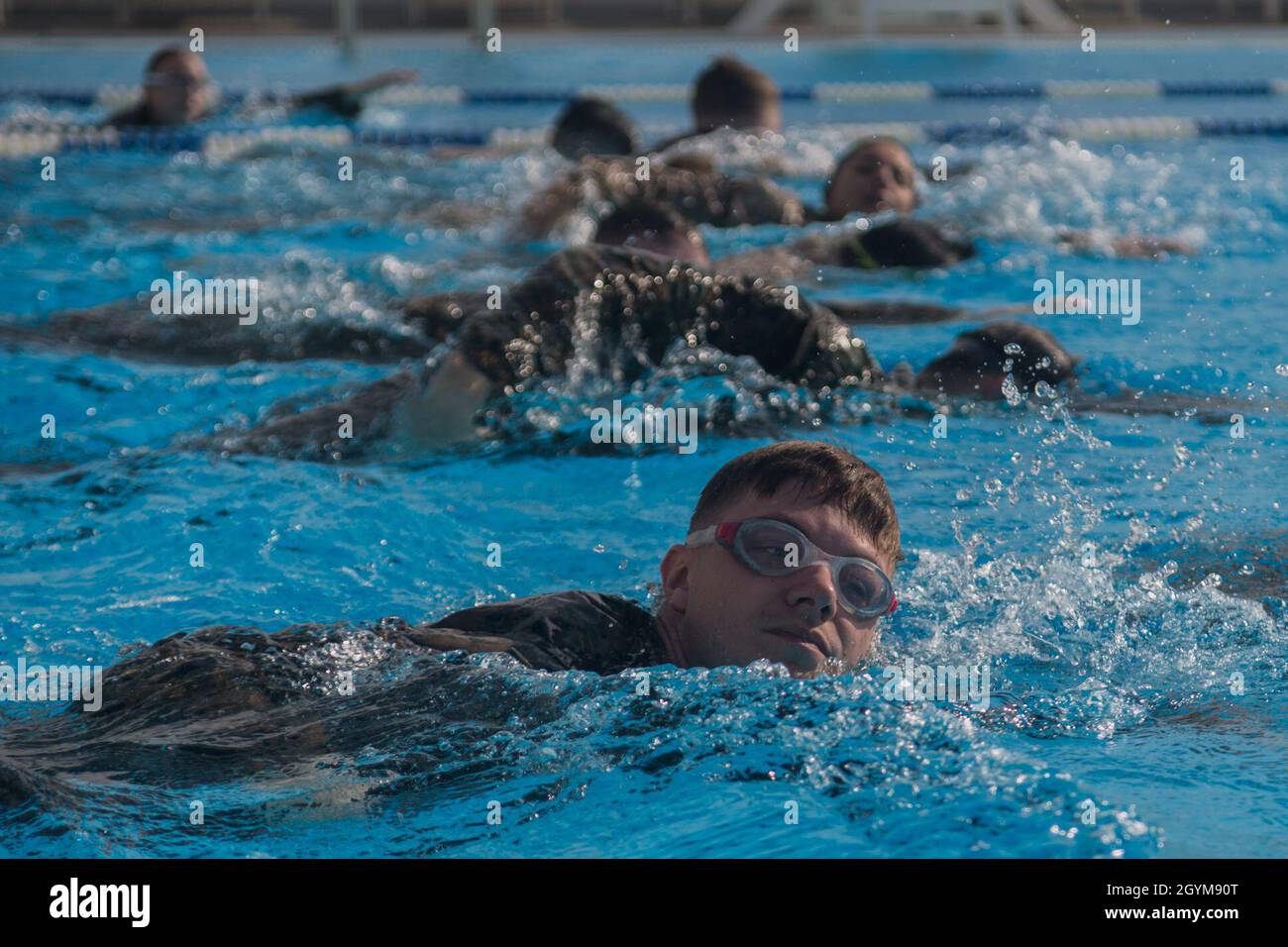 U.S. Marines execute a timed 500-meter swim during a water survival ...