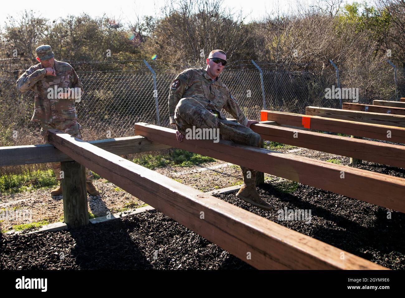 U.S. Air Force Security Forces Airmen take part in the obstacle course ...