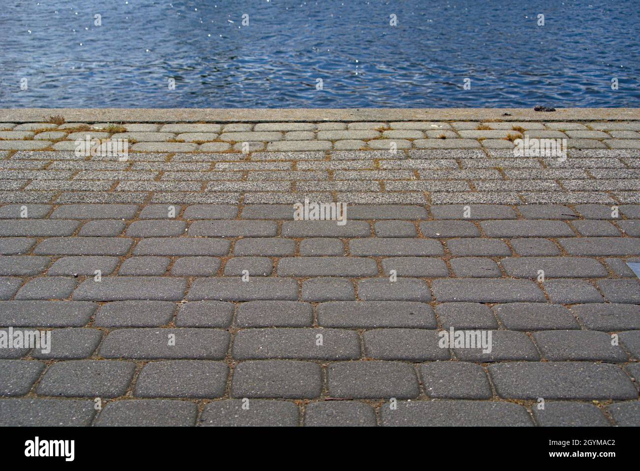 Ground and water surface behind Stock Photo - Alamy