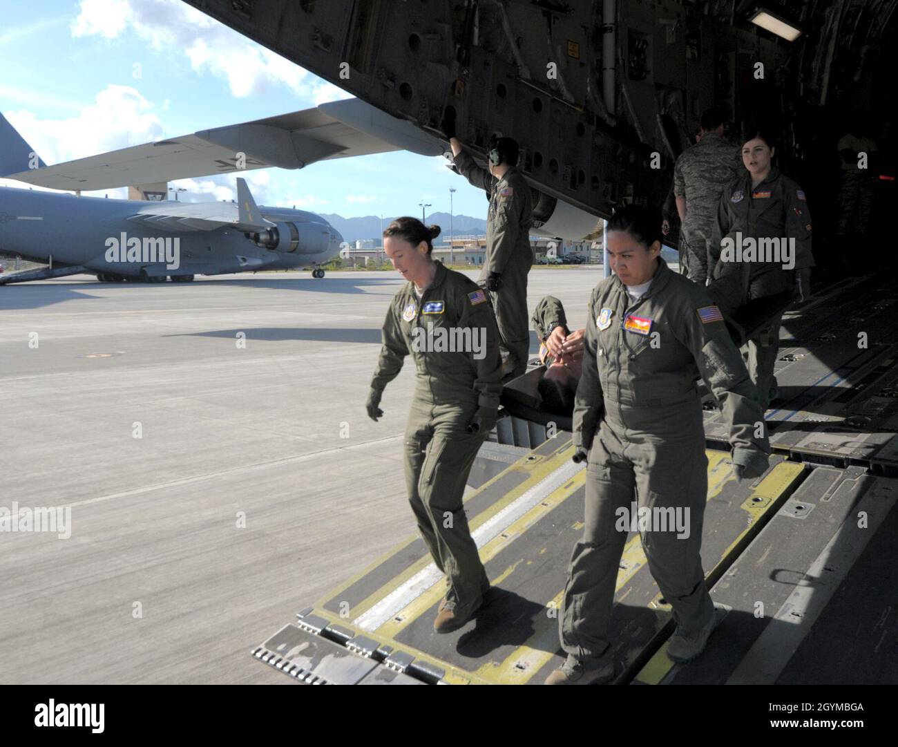 Aeromedical evacuation personnel practice offloading a simulated ...