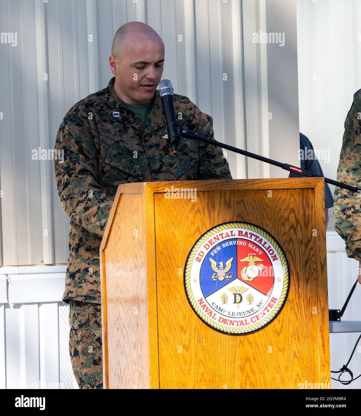 U.S. Navy Lt. Mark E. Coker, Chaplain, 2D Dental Battalion, gives the ...