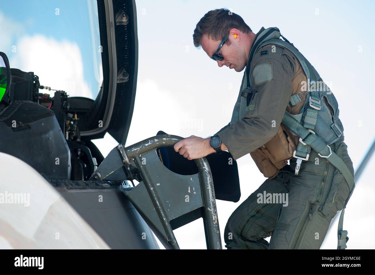 An F-22 Raptor pilot from the 19th Fighter Squadron exits an aircraft ...