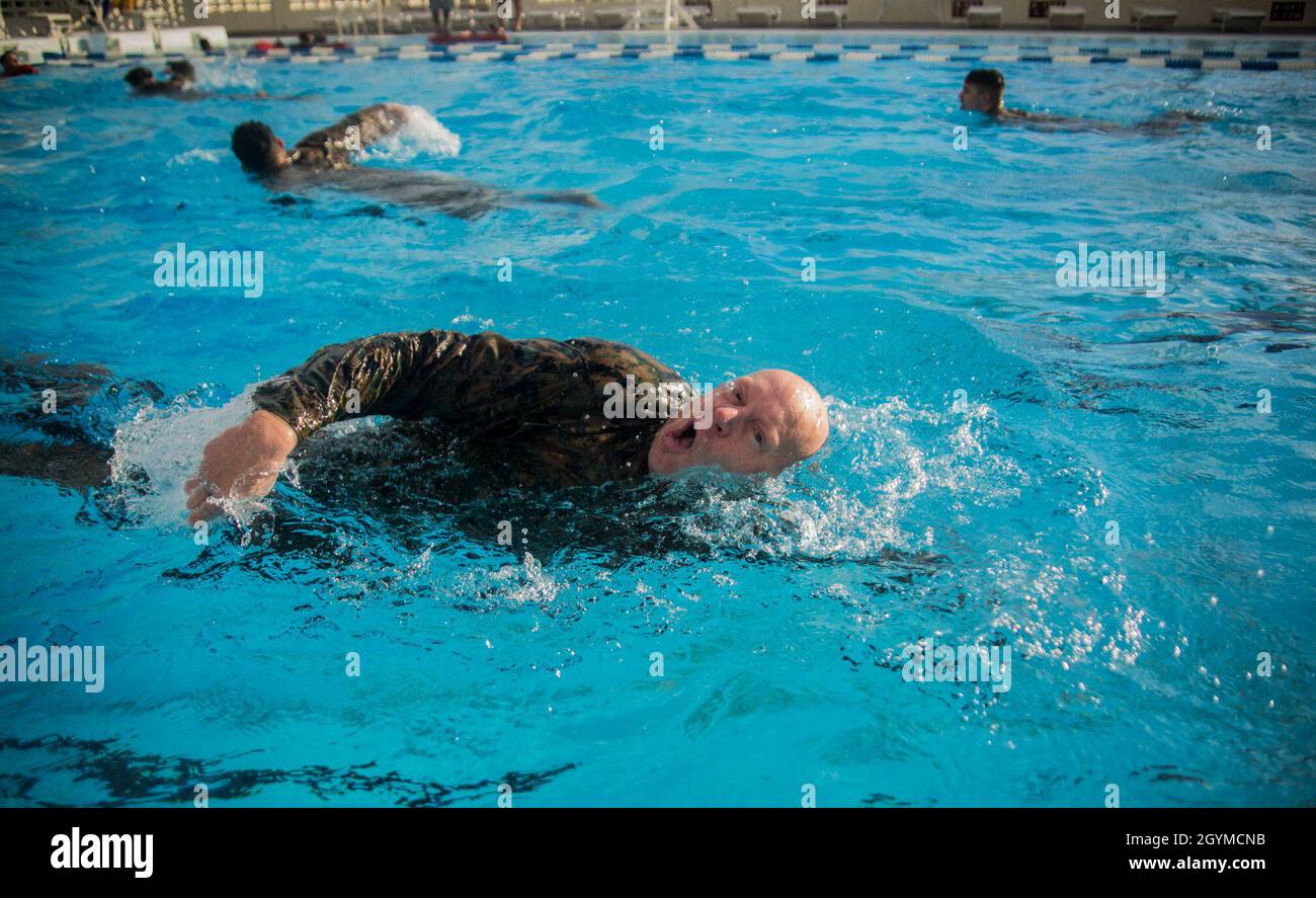 A U.S. Marine preforms a 250-meter swim during water survival advanced ...