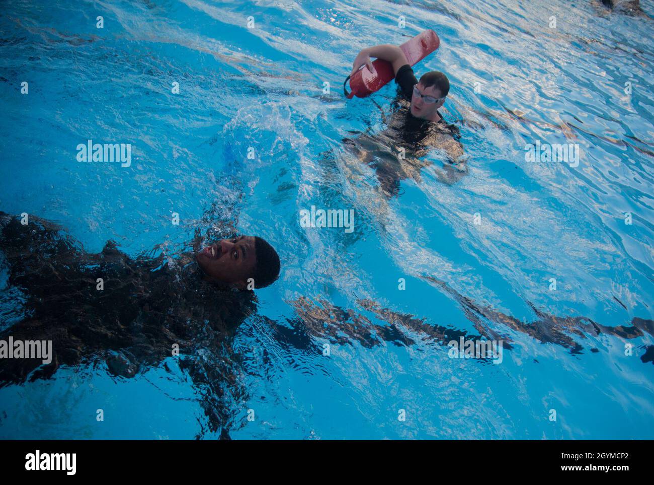 U.S. Marines perform a 25-meter swim during water survival advanced ...