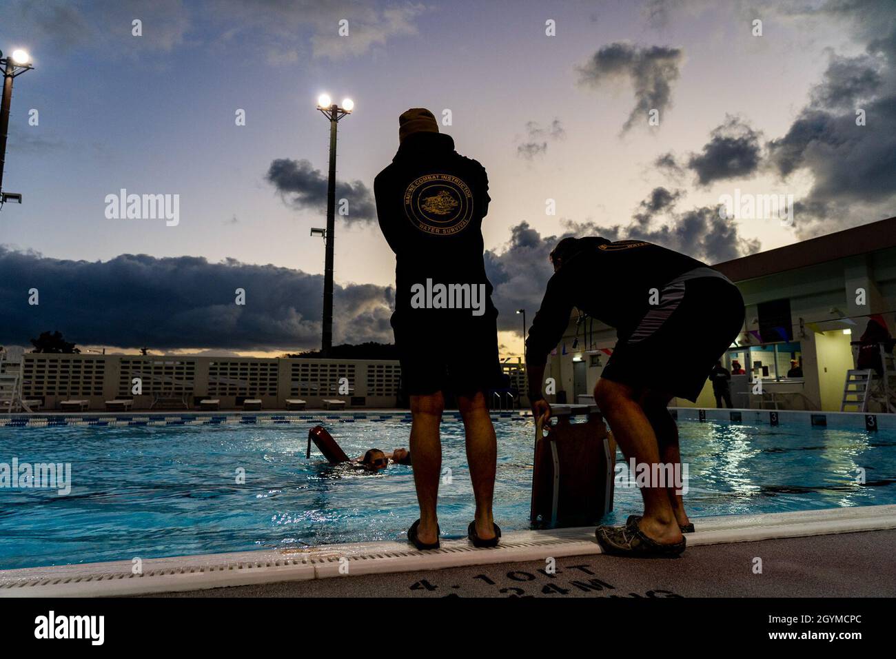 U.S. Marine Corps instructors of water survival conduct simulated ...