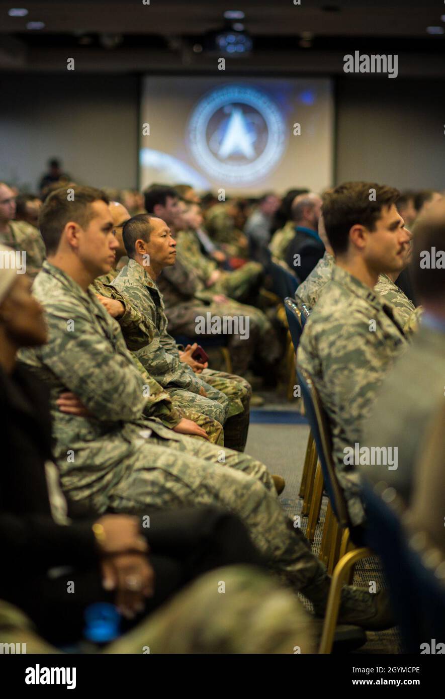Military members of the Space and Missile Systems Center (SMC) look at ...
