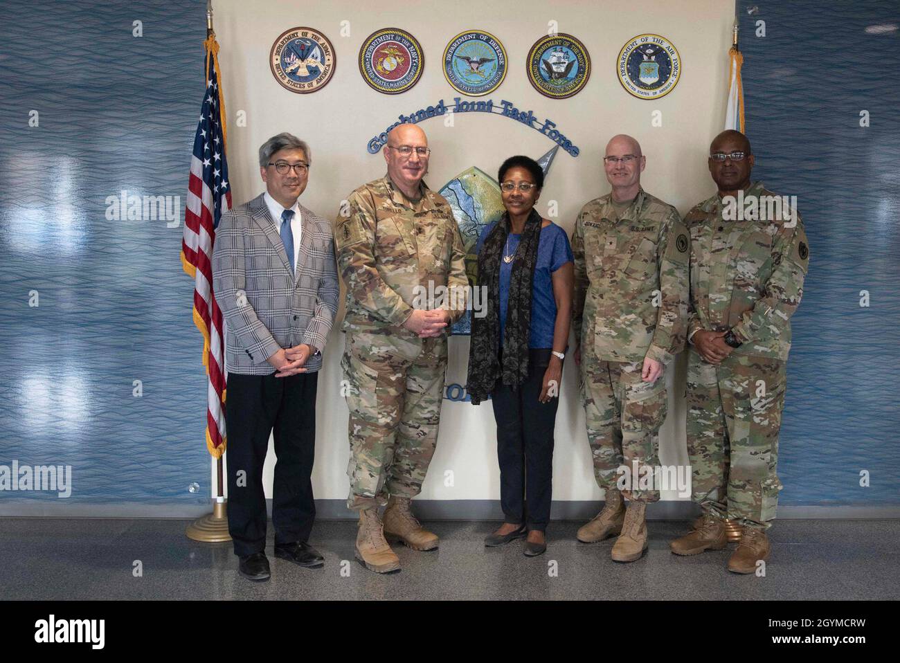 U.S. Army Maj. Gen. Michael D. Turello, center left, commanding general ...