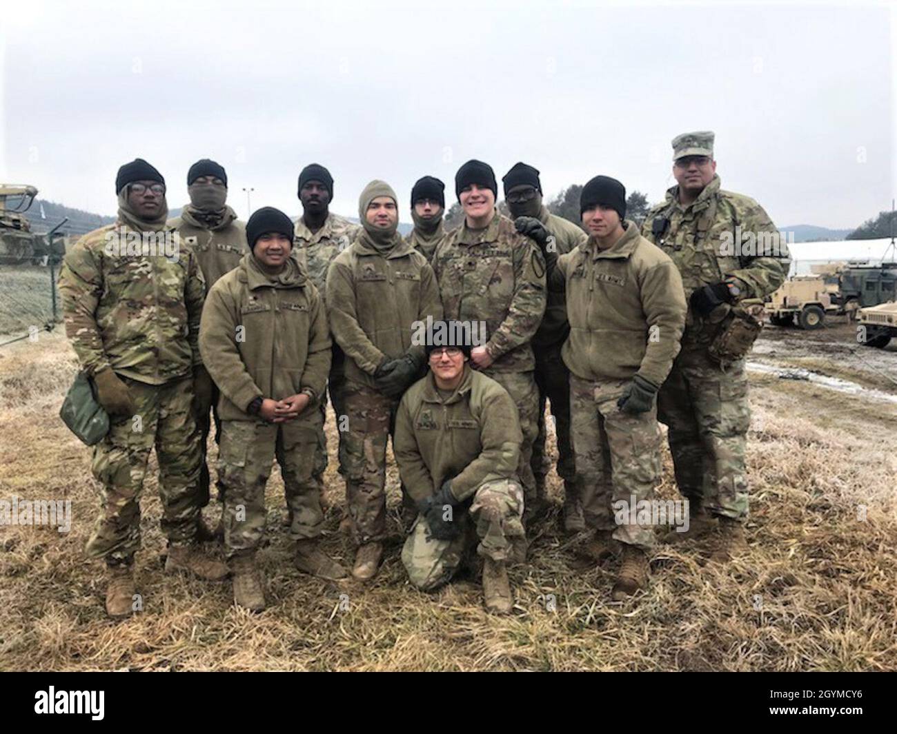 Soldiers assigned to the 49th Calvary Division pose for a group photo ...