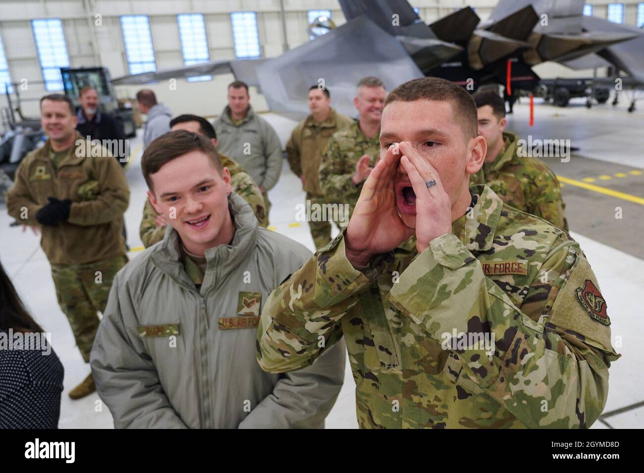 Tech. Sgt. Joshua Granger, a native of Owensboro, KY, cups his hands by ...