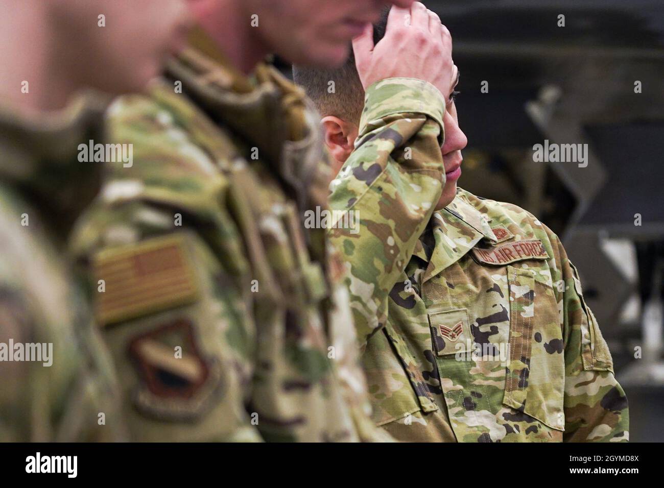 Senior Airman Issiah Alcaide, a native of Brooklyn, rubs his forehead ...