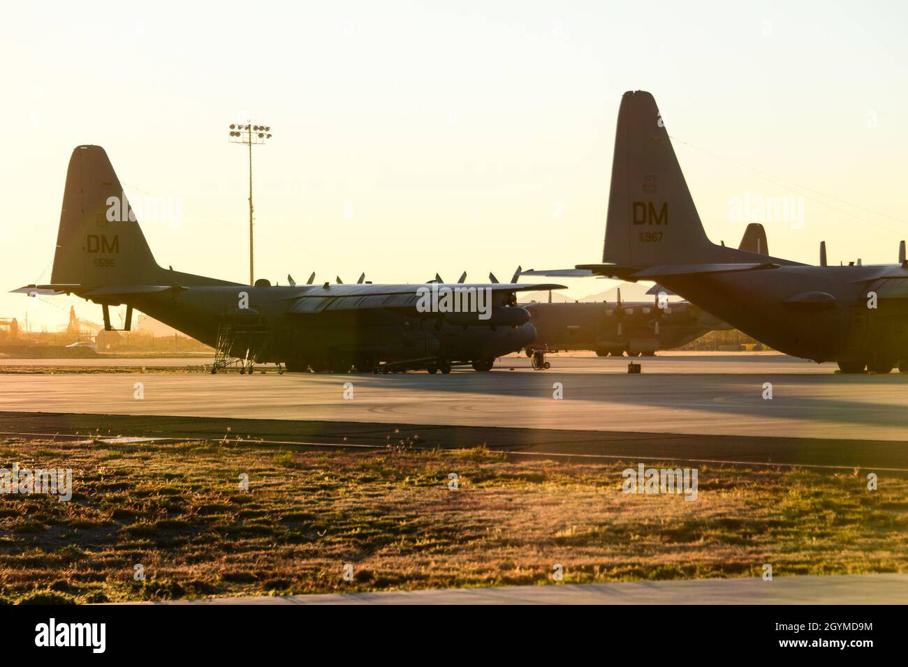 Two U.S. Air Force EC-130H Compass Calls sit on the flight line at ...