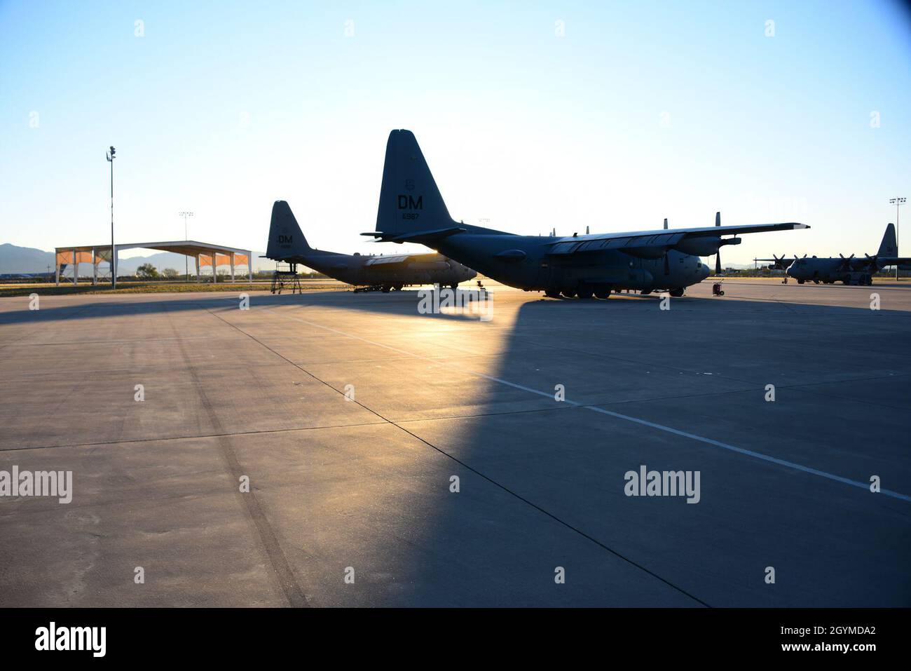 Two U.S. Air Force EC-130H Compass Calls sit on the flight line at ...