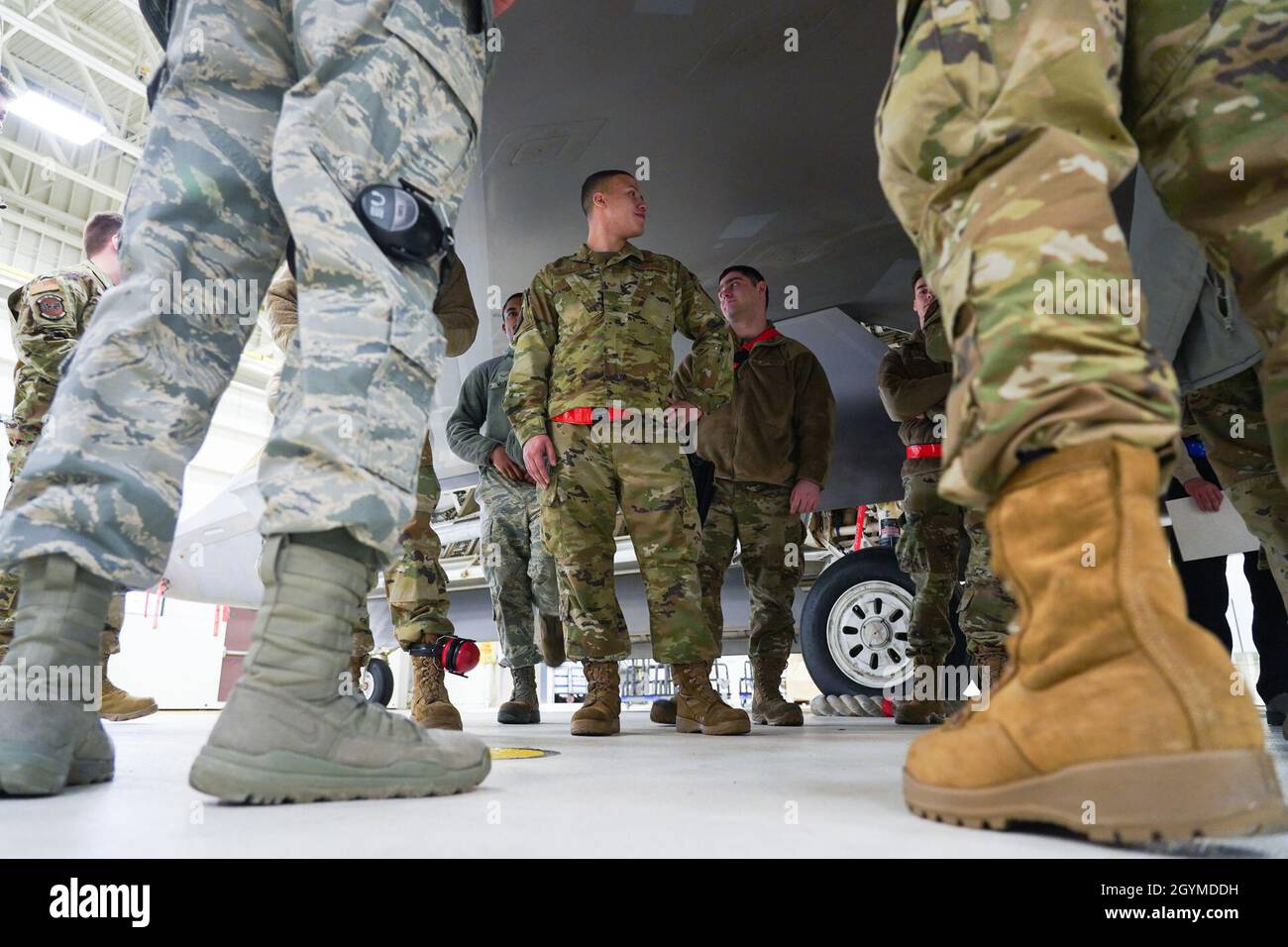 Senior Airman Issiah Alcaide, a native of Brooklyn, center, smiles ...