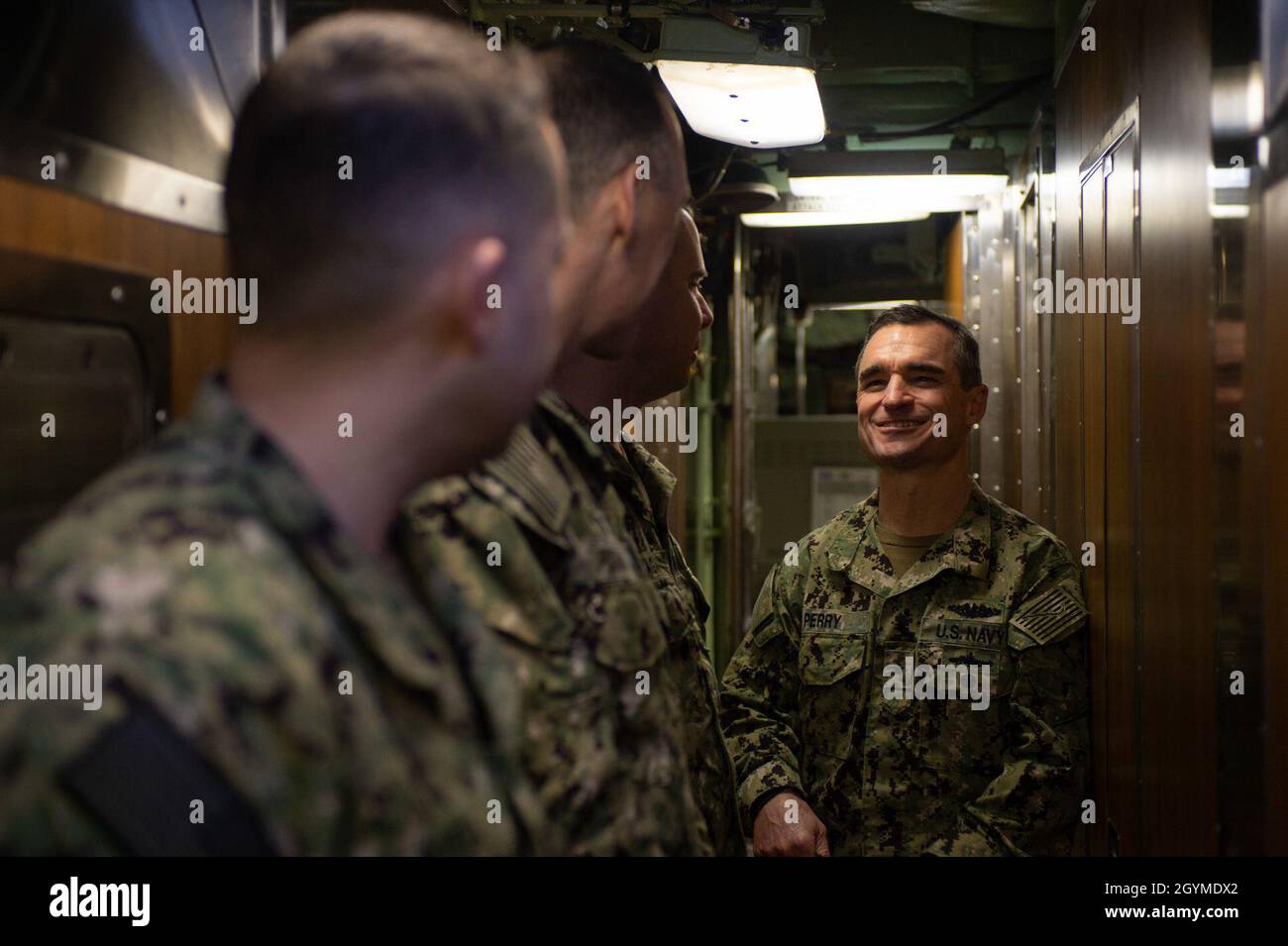 Rear Adm. Doug Perry, Commander, Submarine Group 9, speaks with junior ...