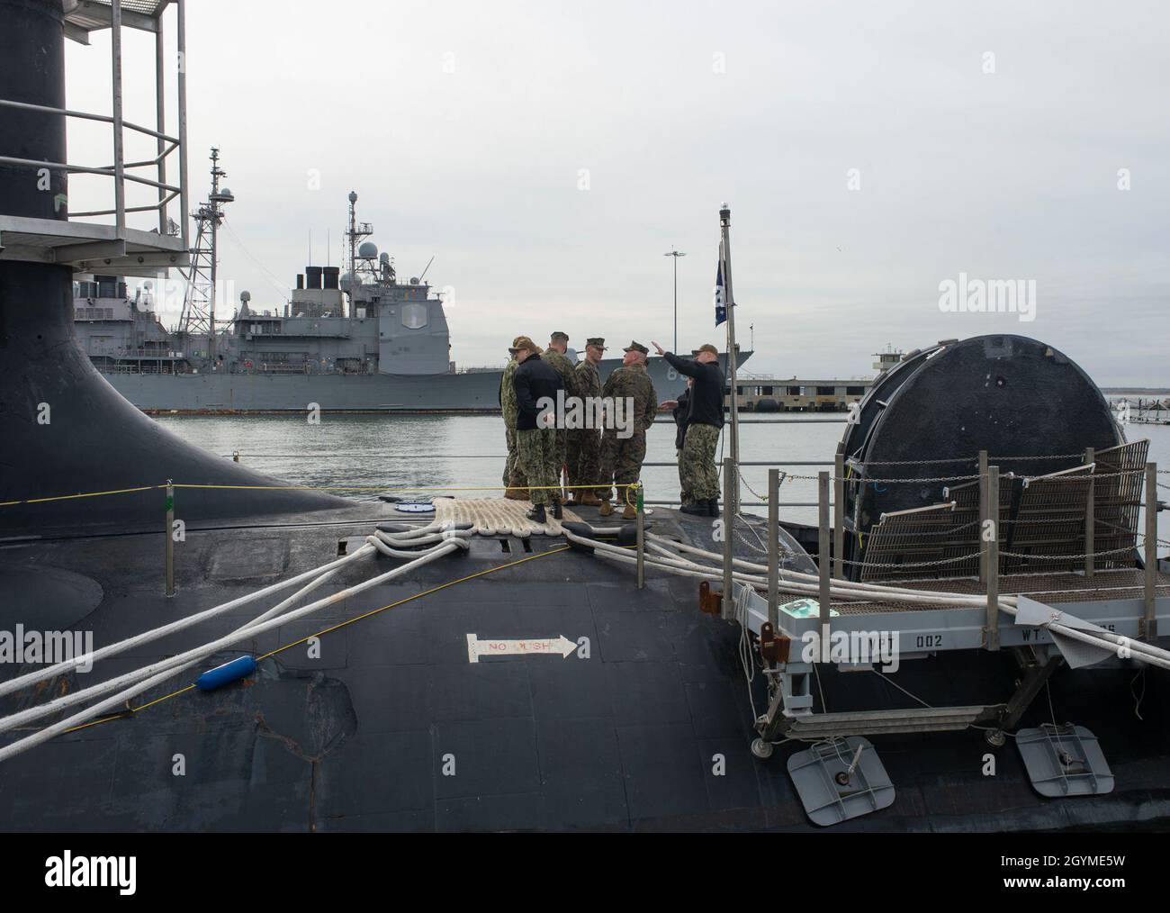 Cmdr. William Wiley, right, commanding officer of USS John Warner (SSN ...