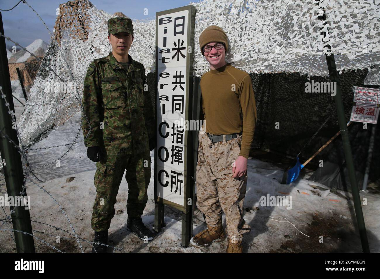 Warrant Officer Go Takeda (Left), assistant operations officer with the ...